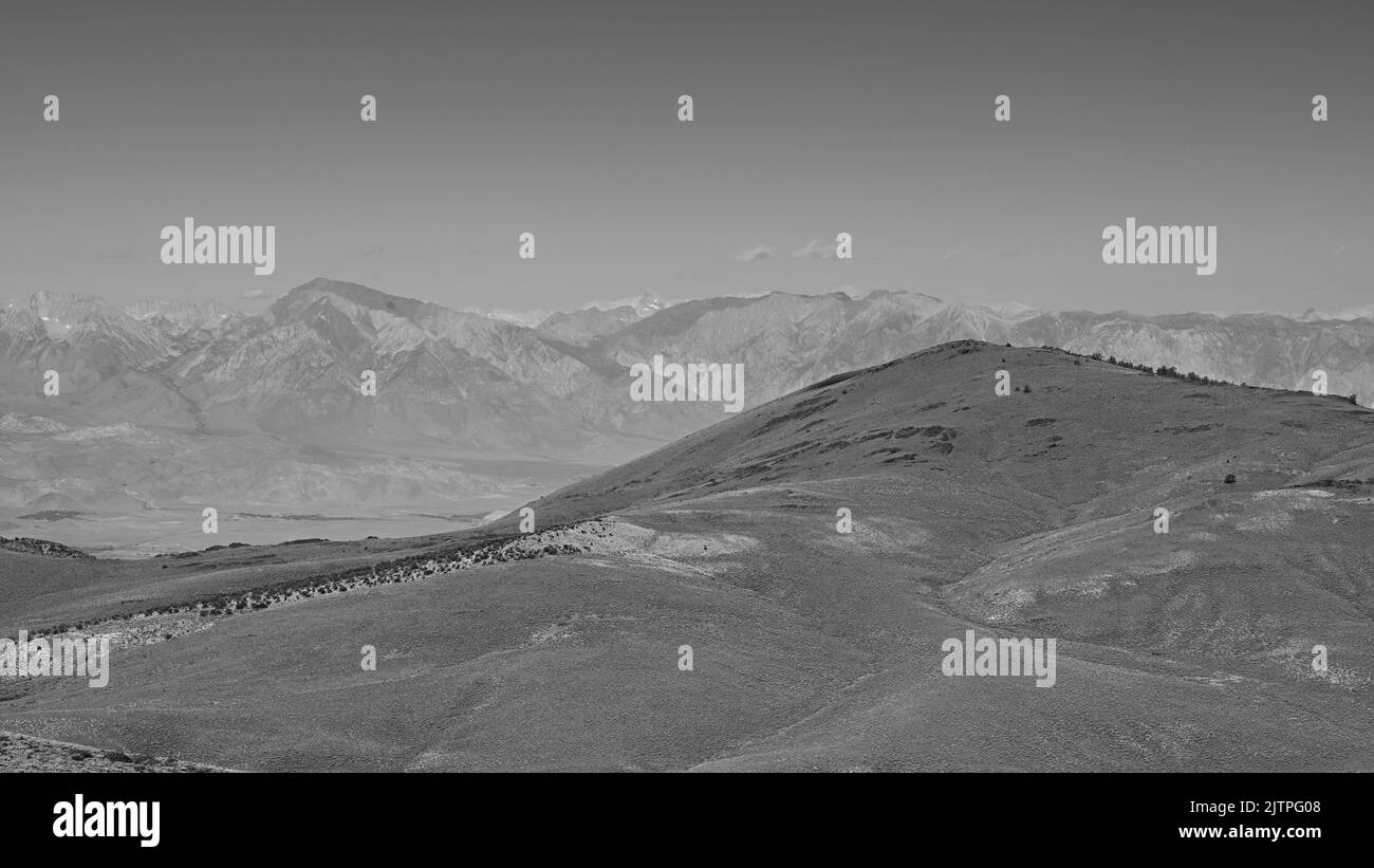 A Grayscale Shot Of The Mountain Range Against The Sky White Mountain Rd California USA Stock a-grayscale-shot-of-the-mountain-range-against-the-sky-white-mountain-rd-california-usa-stock