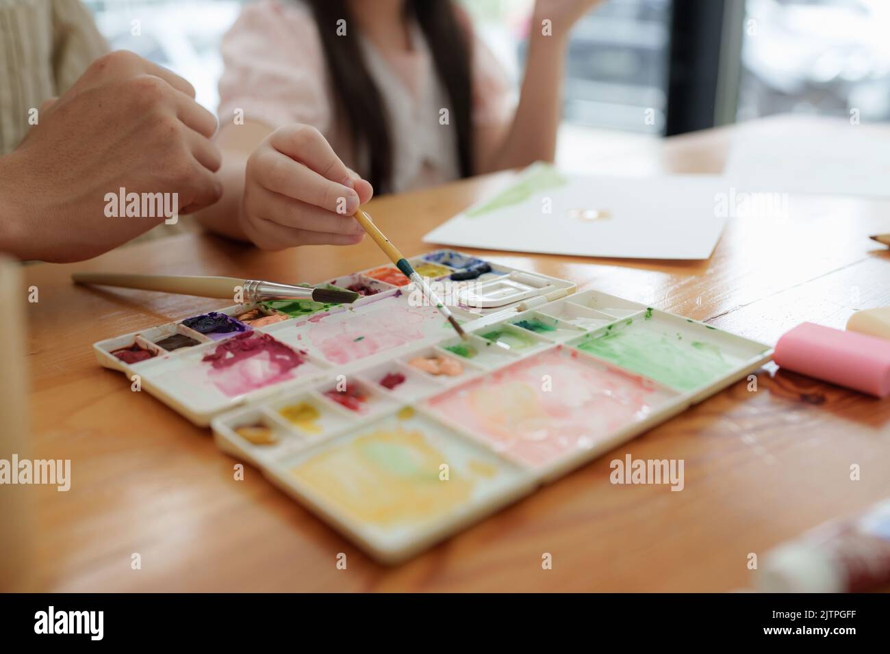 A happy kid and this father painting at home. Handmade skills training ...