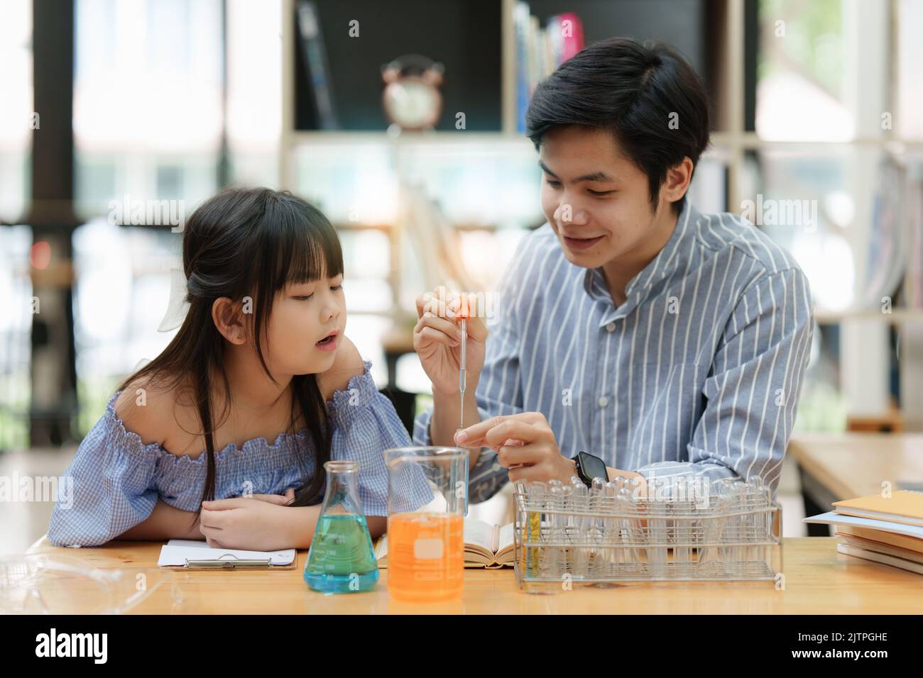 Kid and father doing science experiments. Education science concept ...