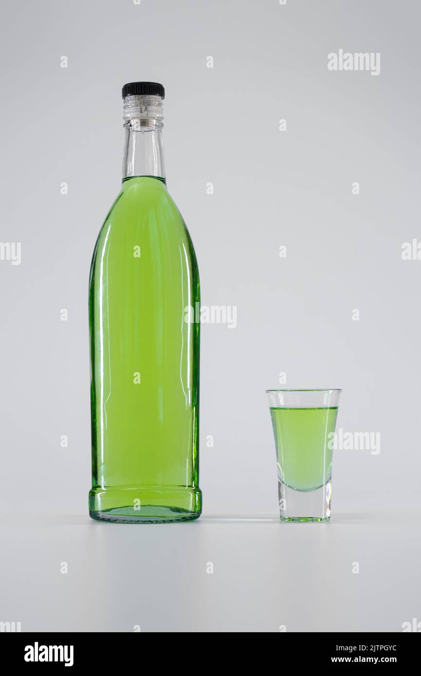 green colored alcohol absinth tincture or liquor with syrup, vodka ...