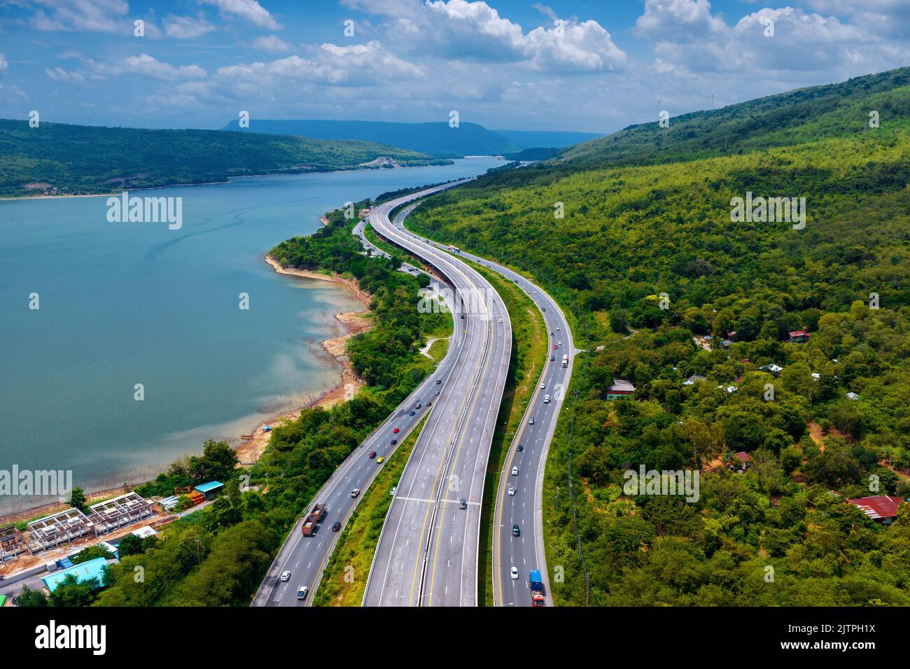 Aerial view of highway near the lake Stock Photo - Alamy