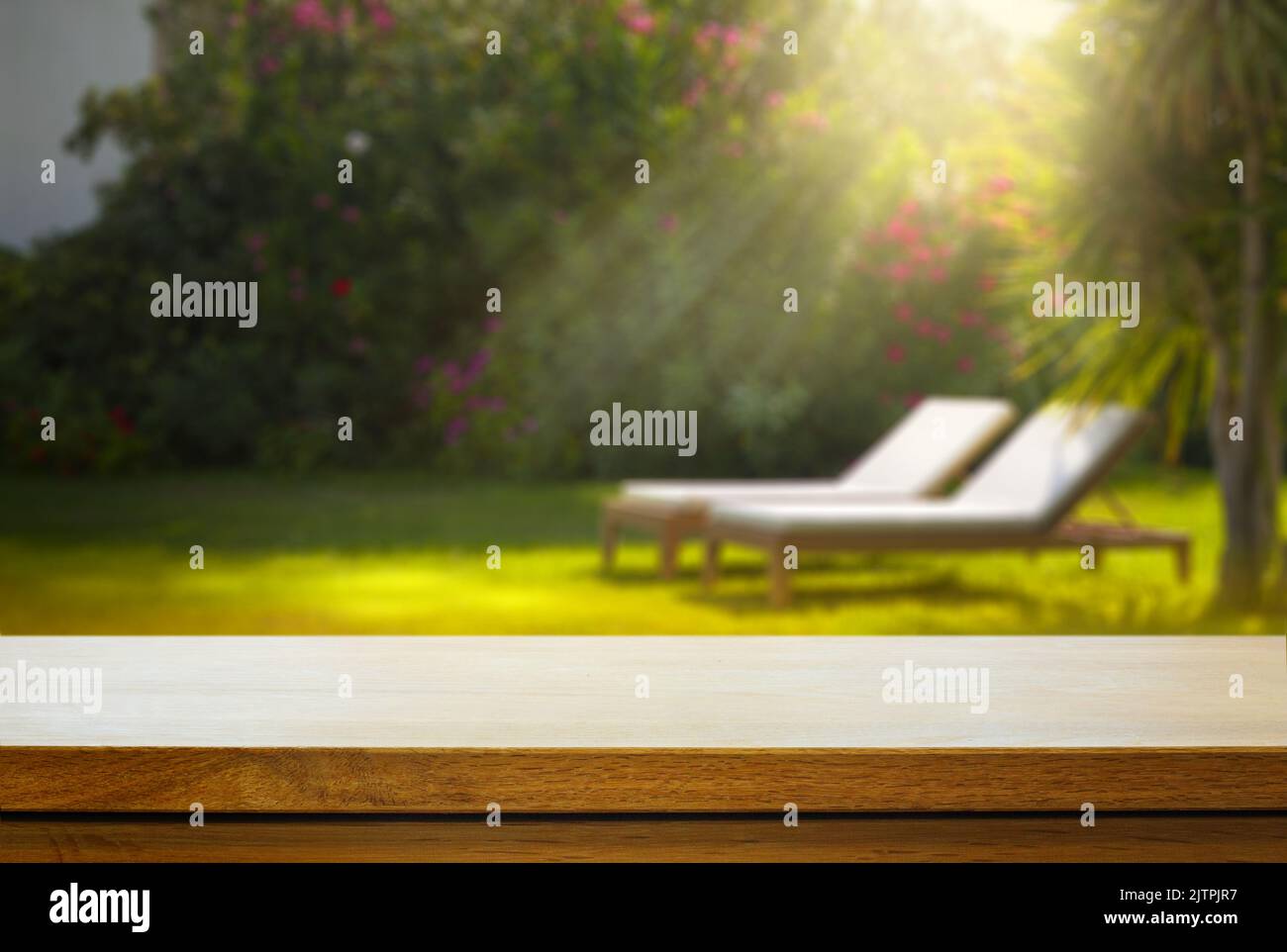 Empty wooden table on sunny blurred tropical patio background. Outdoor ...