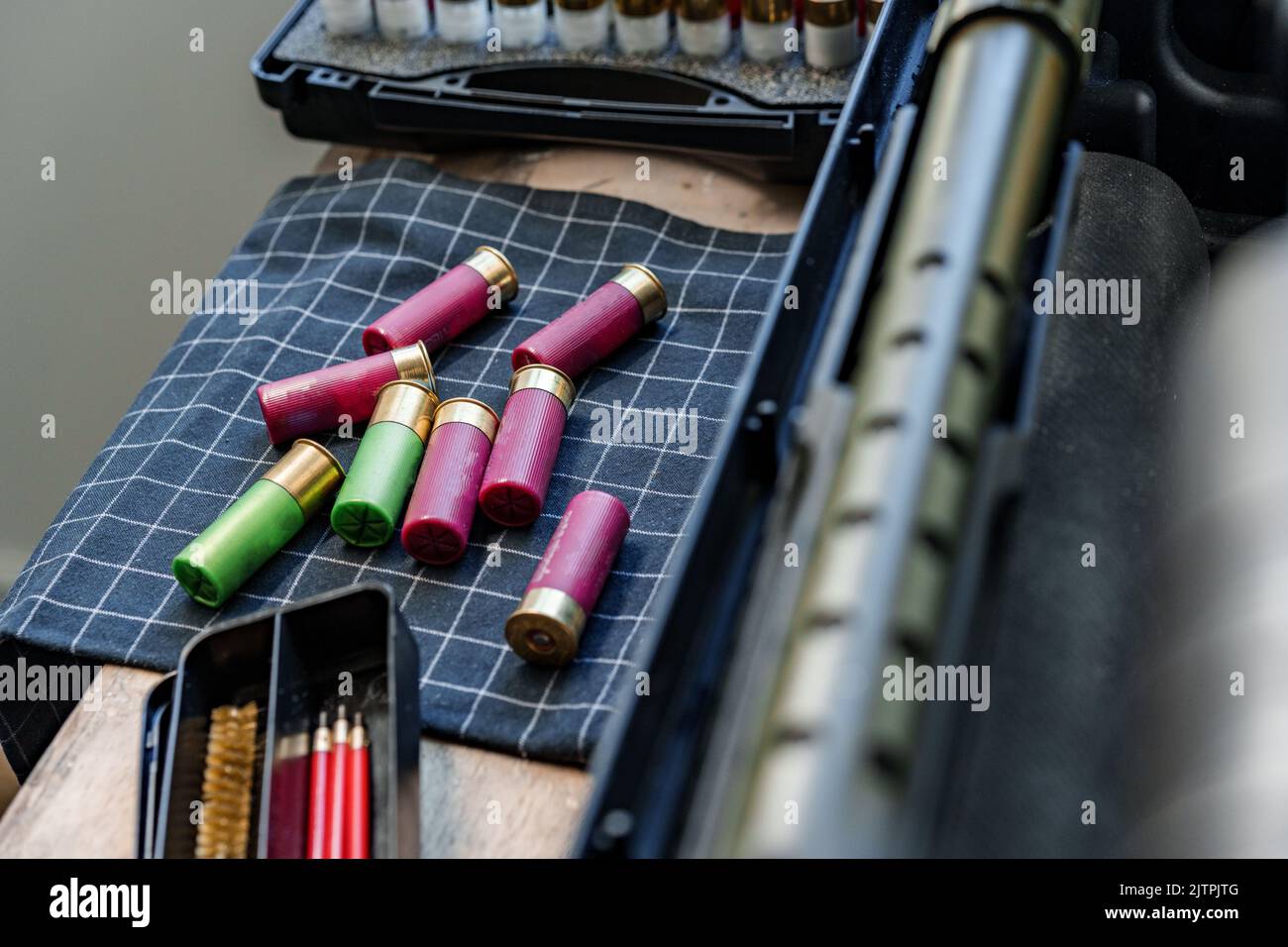 Shotgun rifle with cartridges on table in a weapon workshop Stock Photo ...