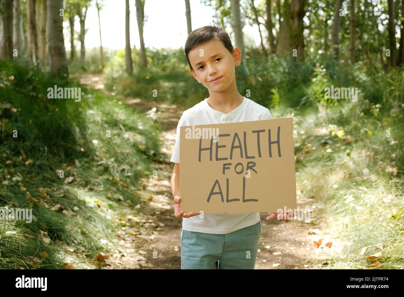child displays the message "health for all". Young activist concerned ...