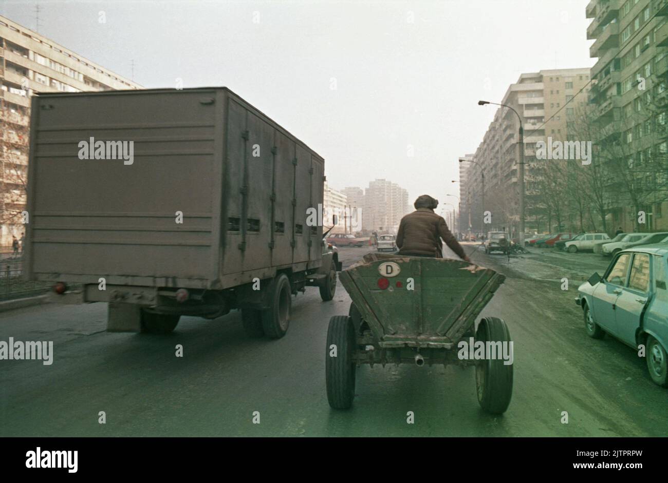 Bucharest, Romania, January 1990. Horse-drawn rudimentary wagon on the ...