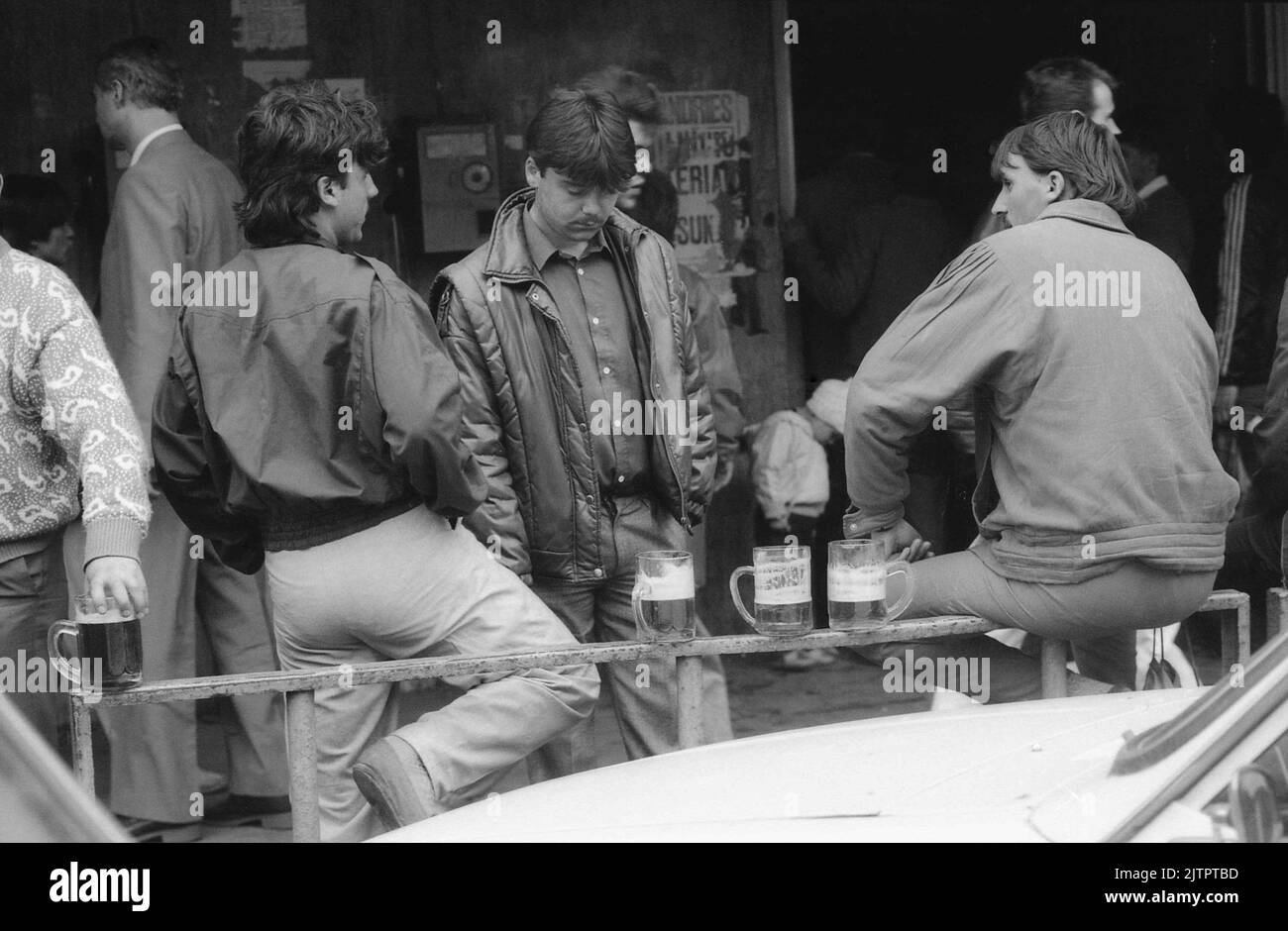 Romania, 1990. Men drinking beer in downtown Bucharest in the ...