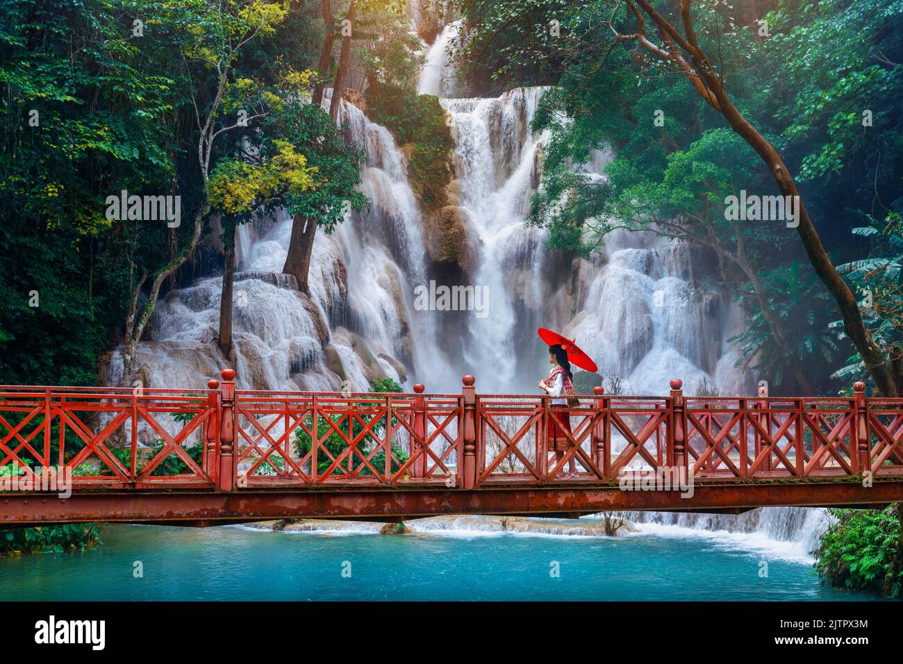 Woman walking at Kuang Si waterfall in Luang Prabang, Laos Stock Photo ...