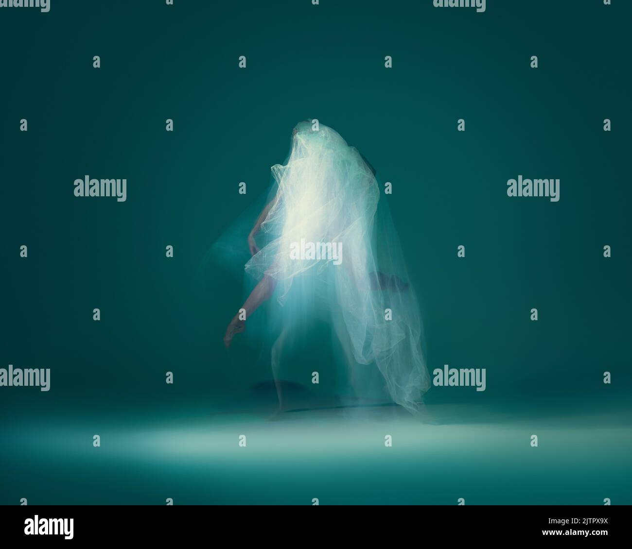 Solo. Beautiful and graceful ballet dancer dancing with white ...