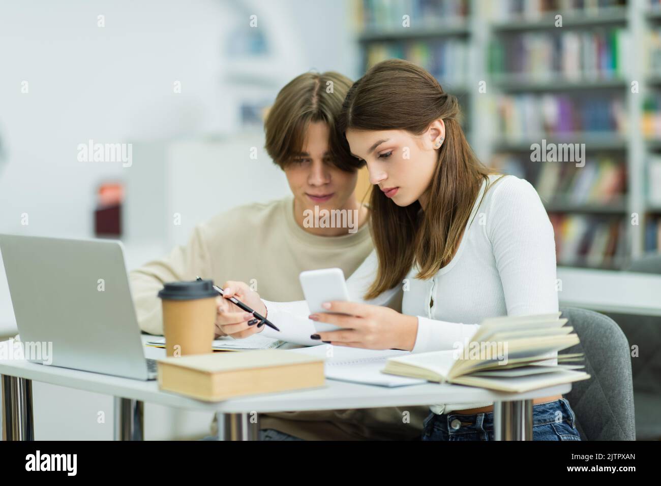 College boy looking laptop hi-res stock photography and images - Alamy
