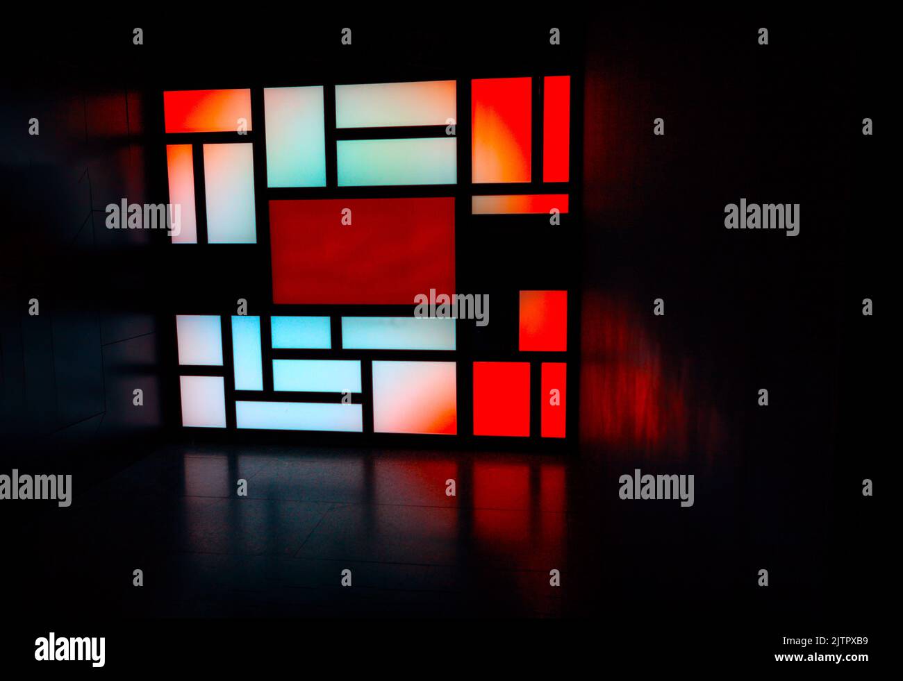 Window with colorful glass in dark room . Gradient light and dim light ...