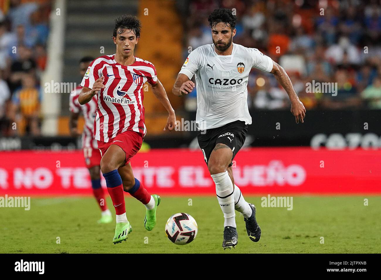 Valencia CF's Eray Comert (r) and Atletico de Madrid's Joao Felix during La Liga match. August ...