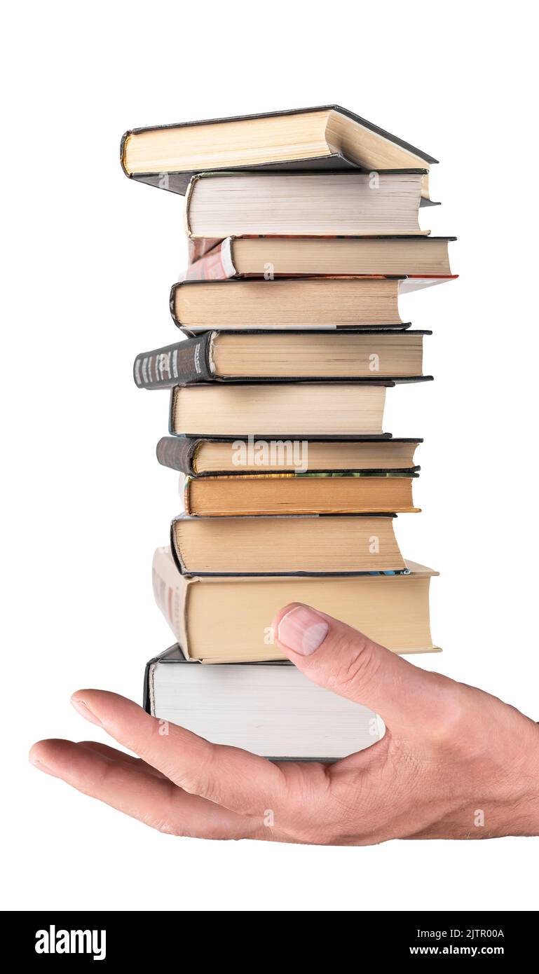 Hand holding books stack isolated on white background. Knowledge, intellectual development ...