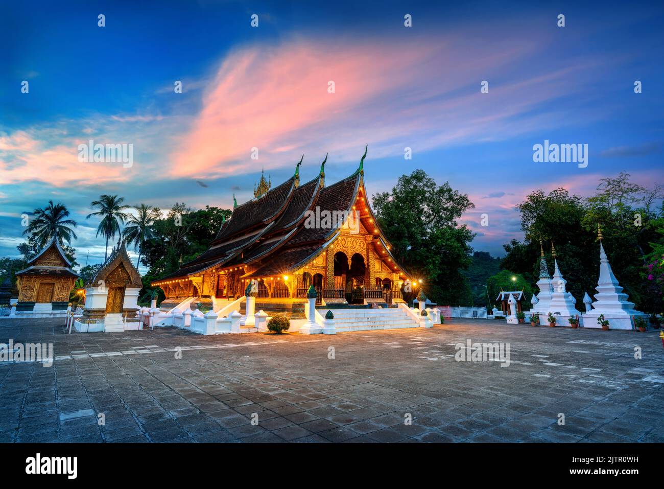 Wat Xieng thong temple at twilight in Luang Pra bang, Laos Stock Photo ...