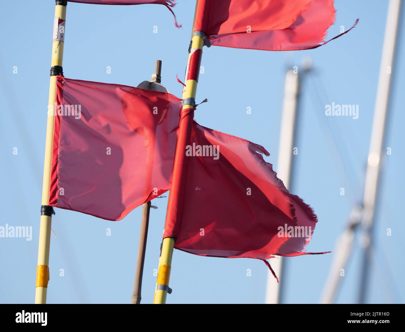 Flags for fisherman's creels on a fishing boat in the port of ...