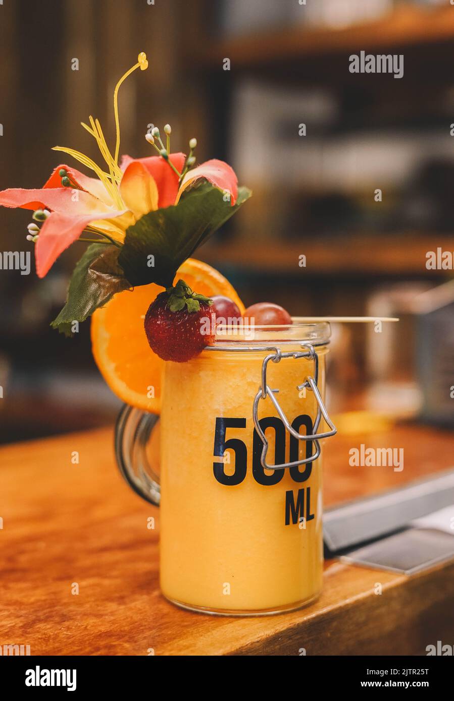 tropical cocktail of alcohol and natural juices Stock Photo - Alamy