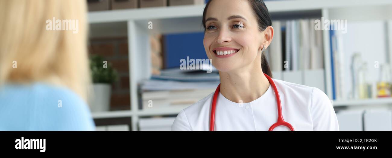 Doctor gynecologist showing and explaining female patients ...