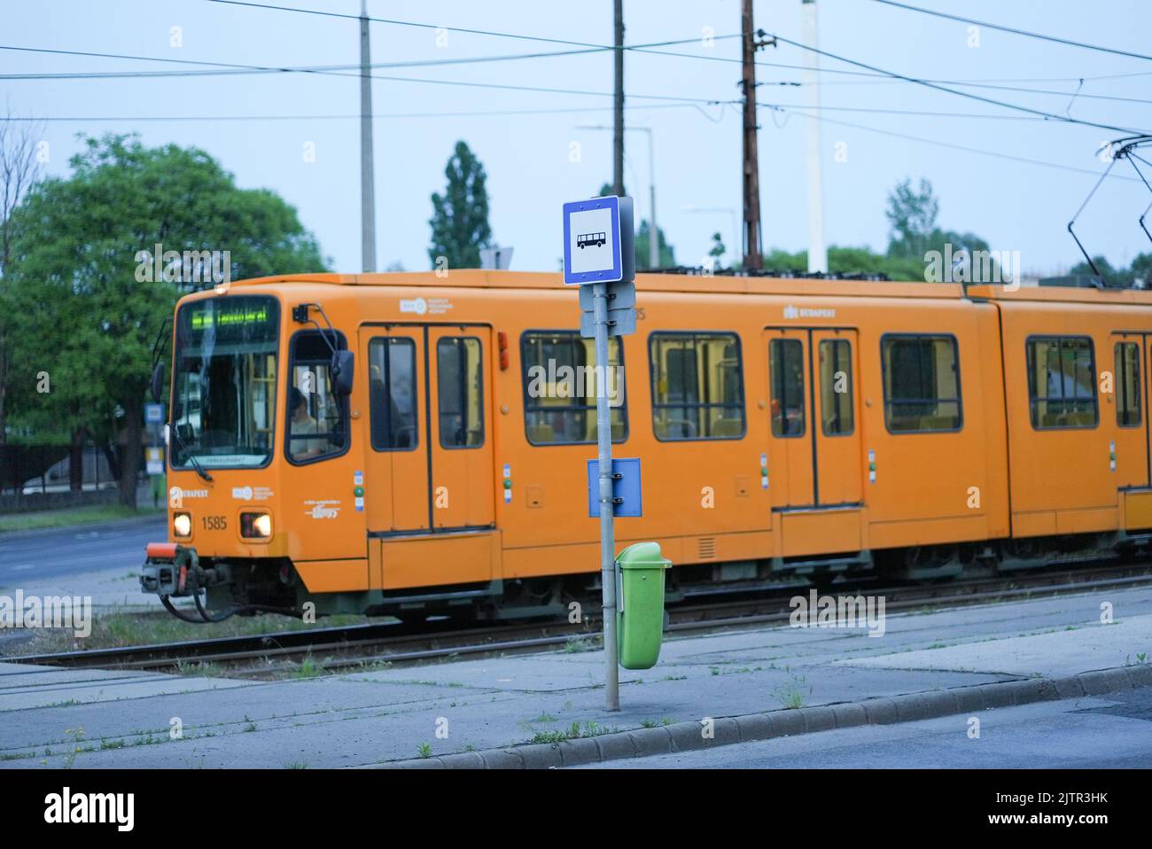 old tram passing in the suburban area of a city Stock Photo - Alamy