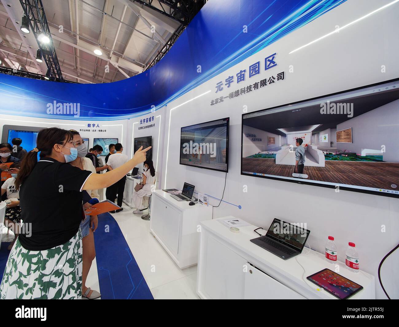 BEIJING, CHINA - SEPTEMBER 1, 2022 - Visitors visit the booth of ...