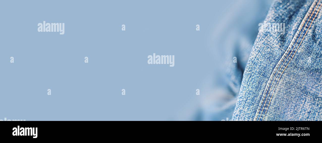 A denium blue jean closeup, banner with space for text. View of old ...