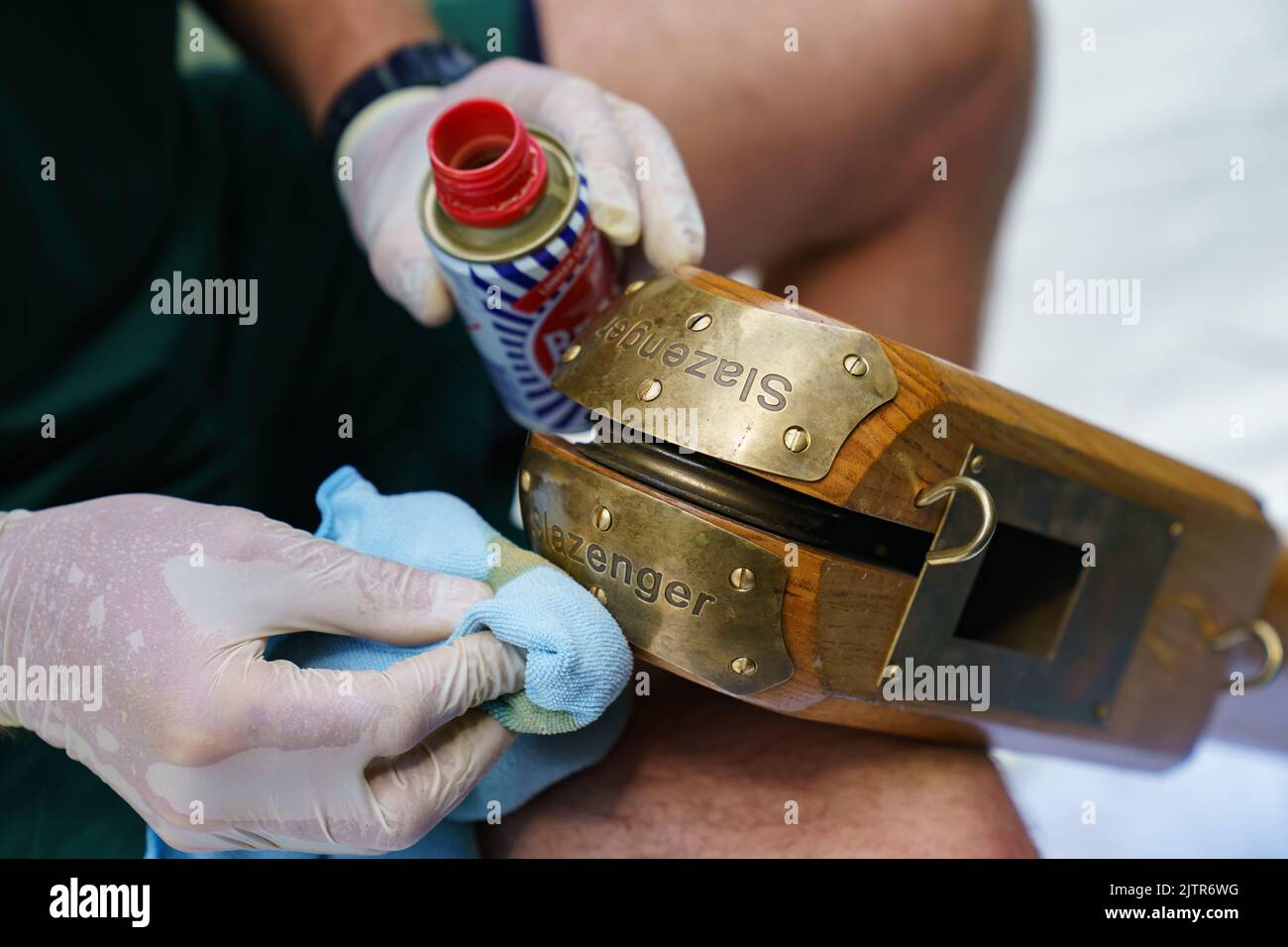 Groundsman polishes a net post at The Championships 2022. Held at The ...
