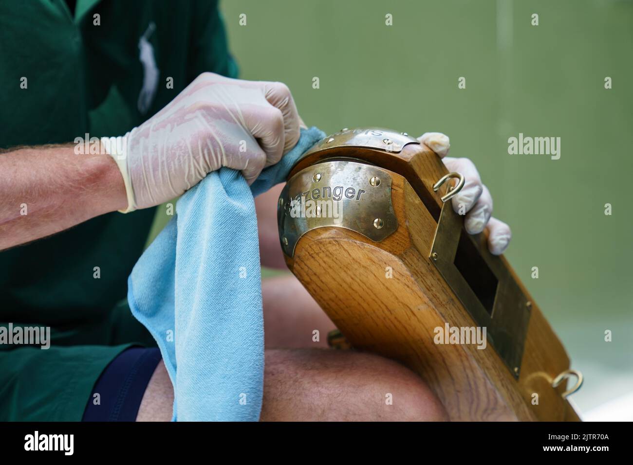 Groundsman polishes a net post at The Championships 2022. Held at The ...