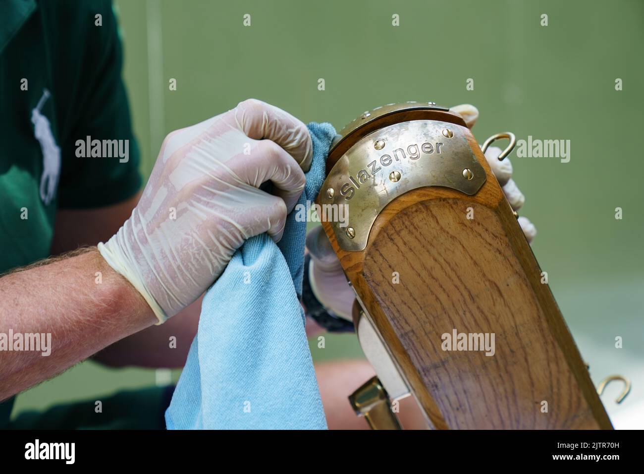 Groundsman polishes a net post at The Championships 2022. Held at The ...