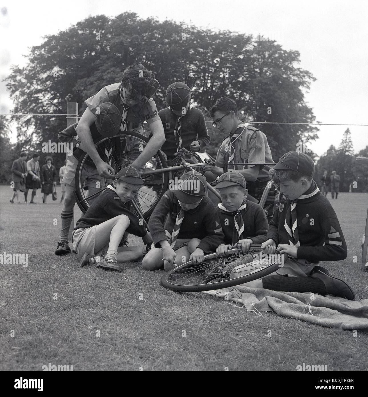 1965, historical, scout rally, sitting on the ground outside in ...