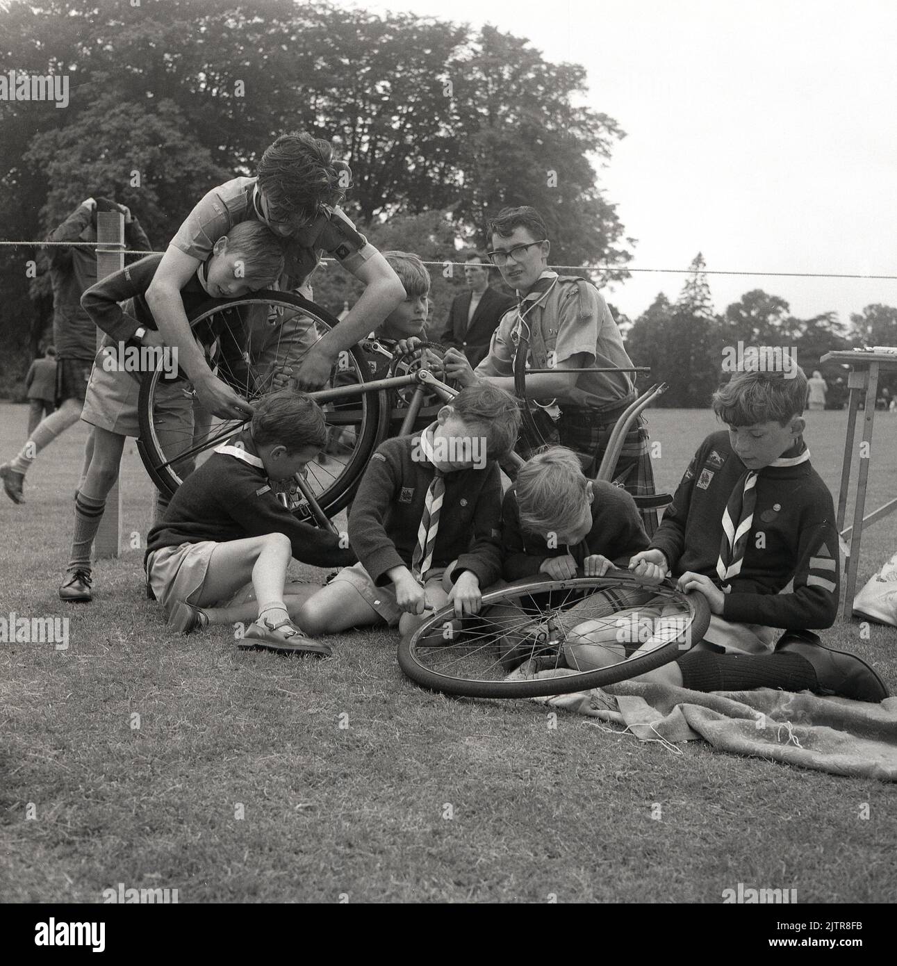 1965, historical, scout rally, sitting on the ground outside in ...