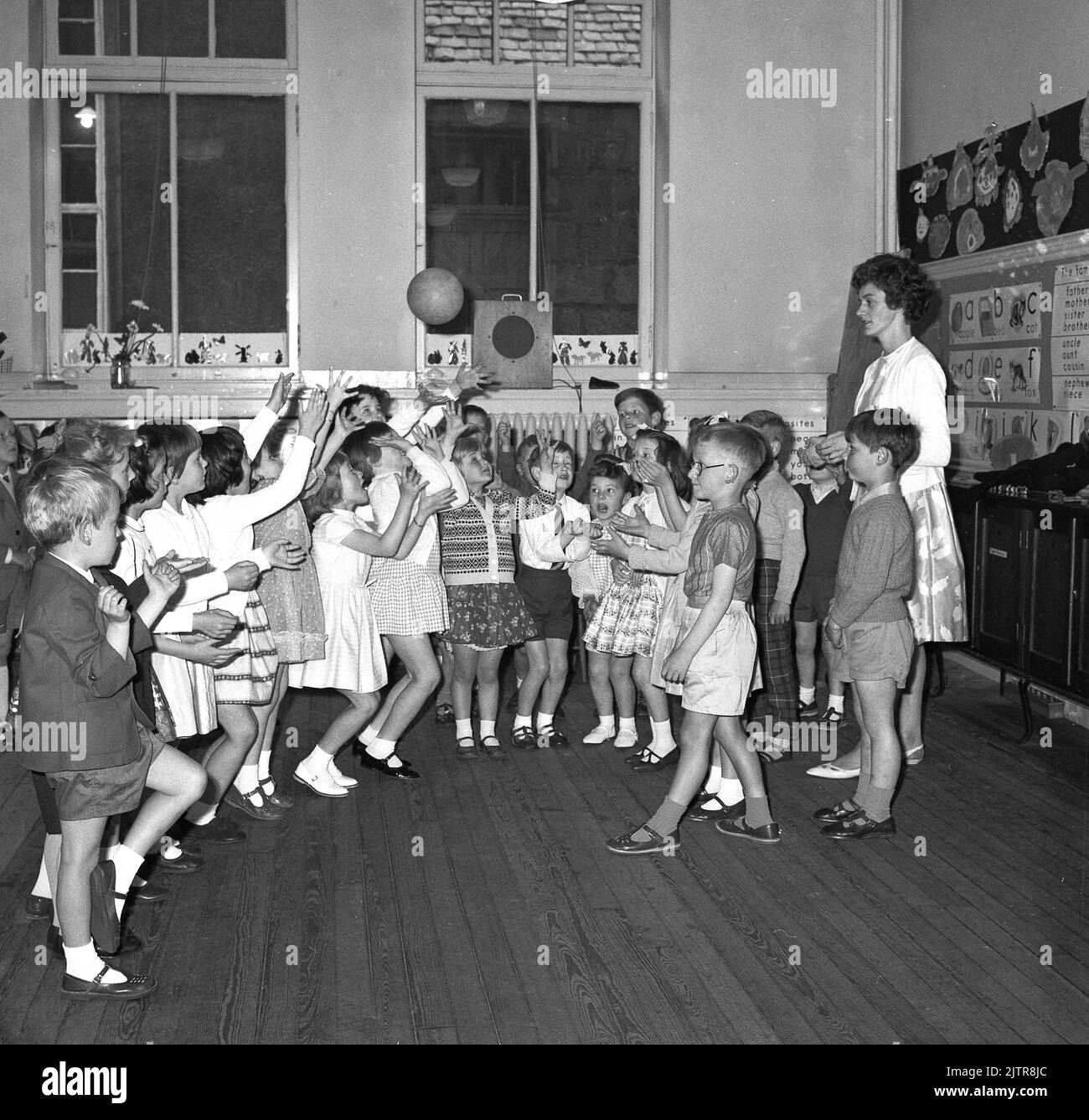 1960s children playing indoor hi-res stock photography and images - Alamy