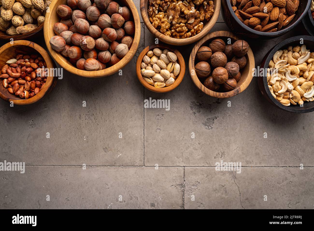 Assortment of nuts in bowls Stock Photo - Alamy