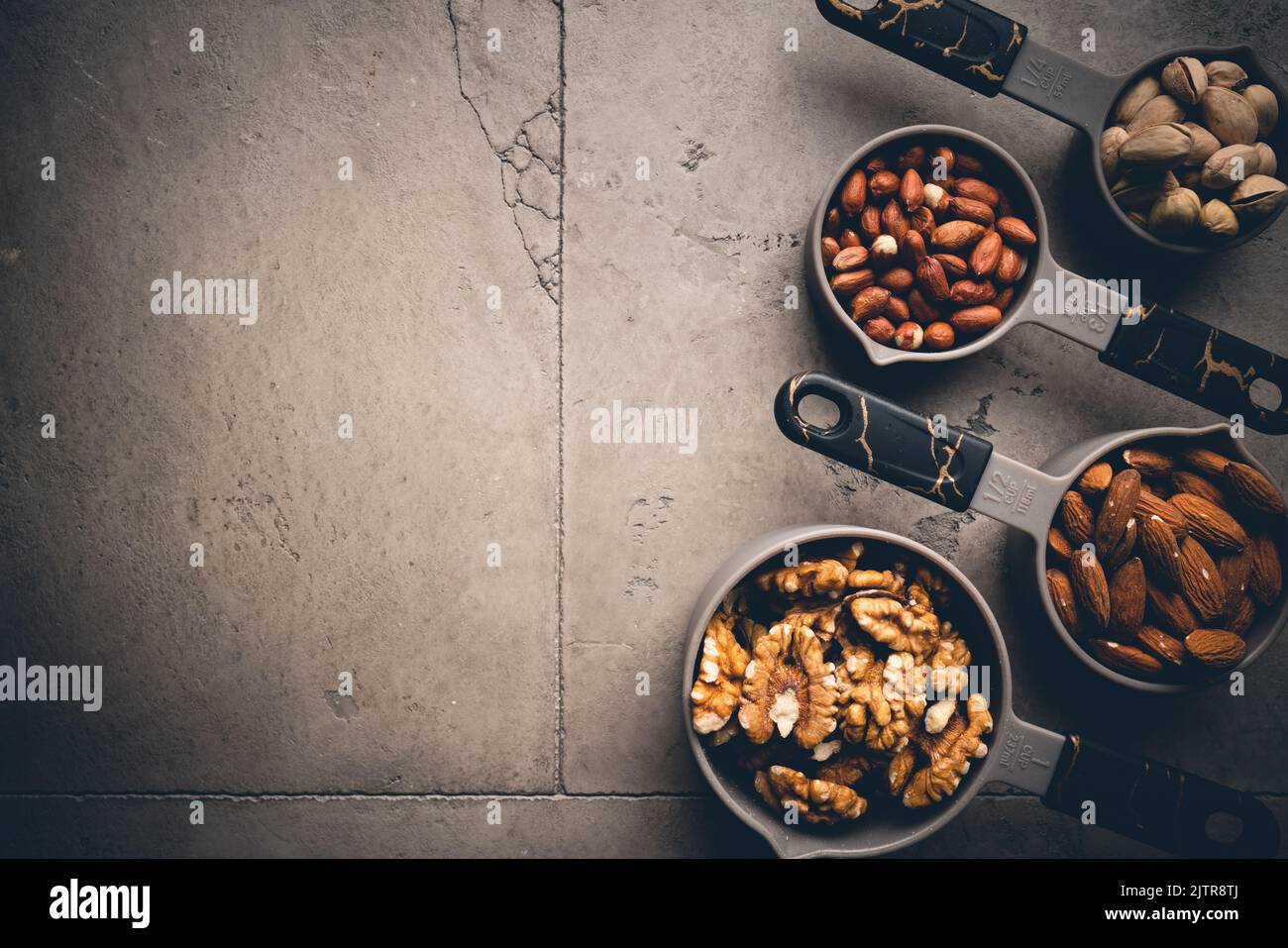 Assortment of nuts in bowls Stock Photo - Alamy