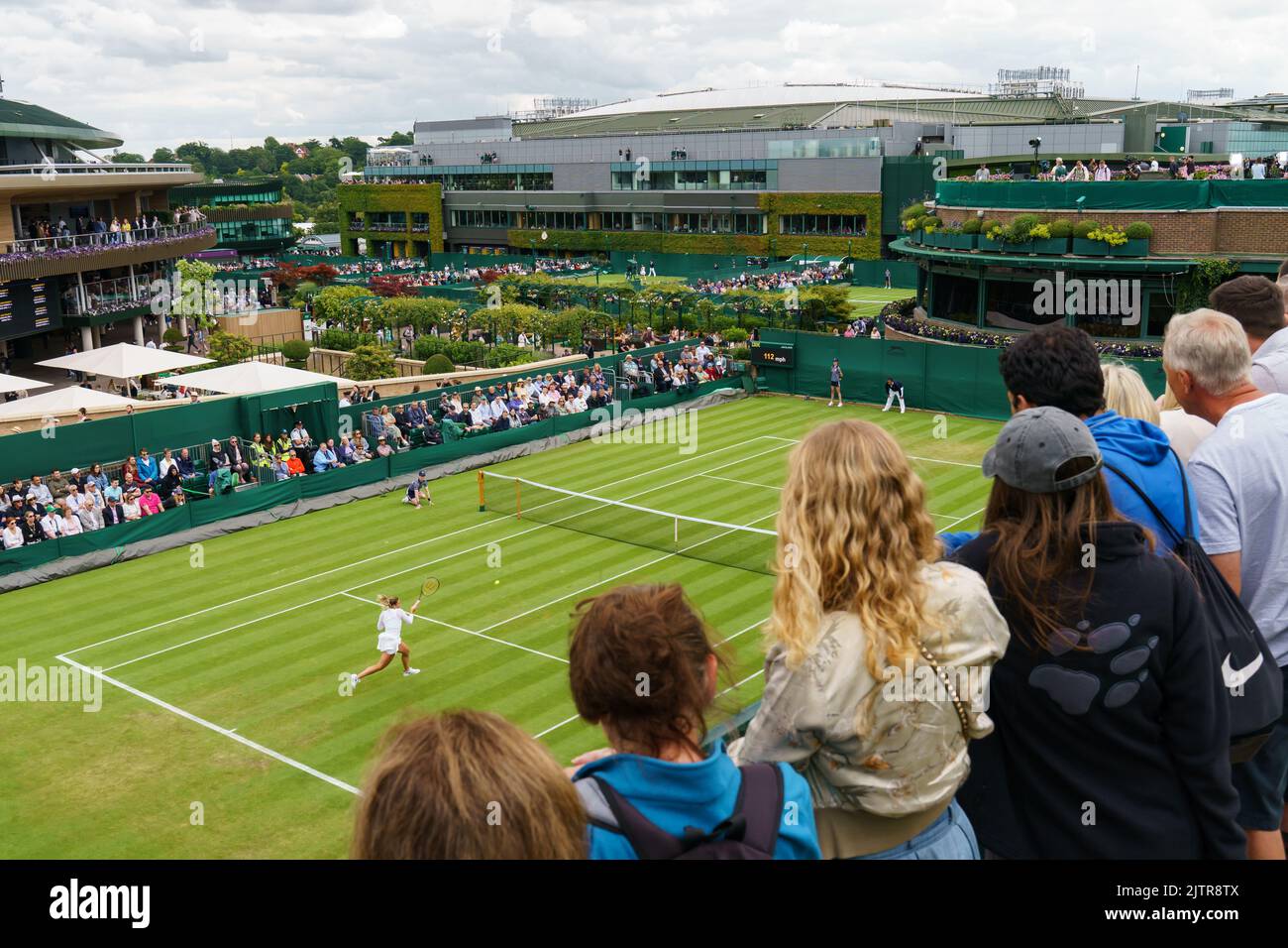Katie Swan and Clara Burel on Court 18 at The Championships 2022. Held ...