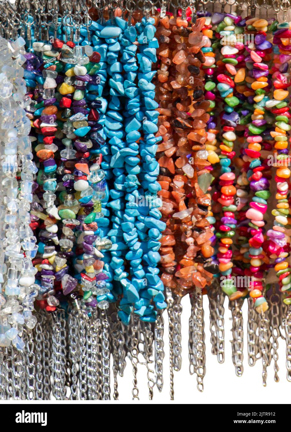 Colorful semi-precious stones. Different shapes rock pebbles. Semi ...