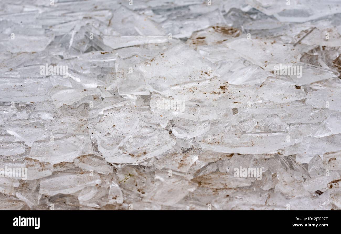 Crushed ice. Chunks of ice pushed to the edge of the lake. Conceptual ...