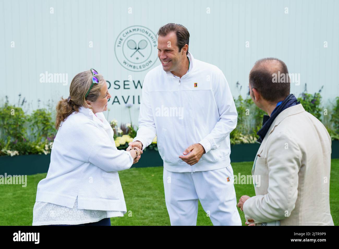 Greg Rusedski talks with guests at The Rosewater Pavilion at Wimbledon ...