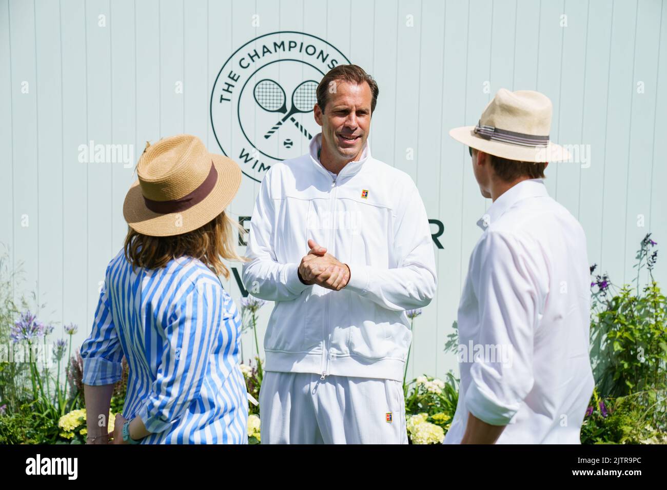 Greg Rusedski talks with guests at The Rosewater Pavilion at Wimbledon ...