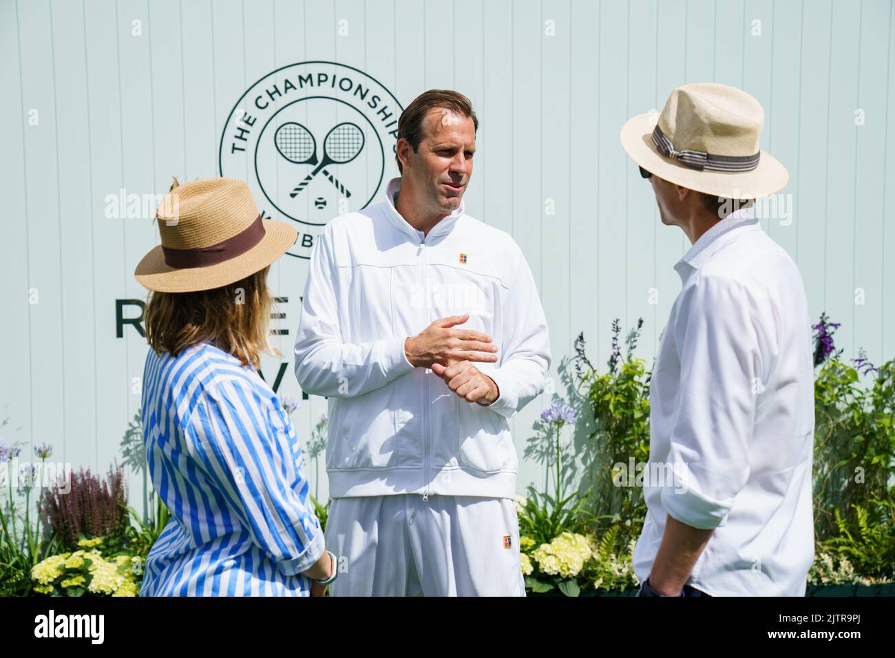 Greg Rusedski talks with guests at The Rosewater Pavilion at Wimbledon ...