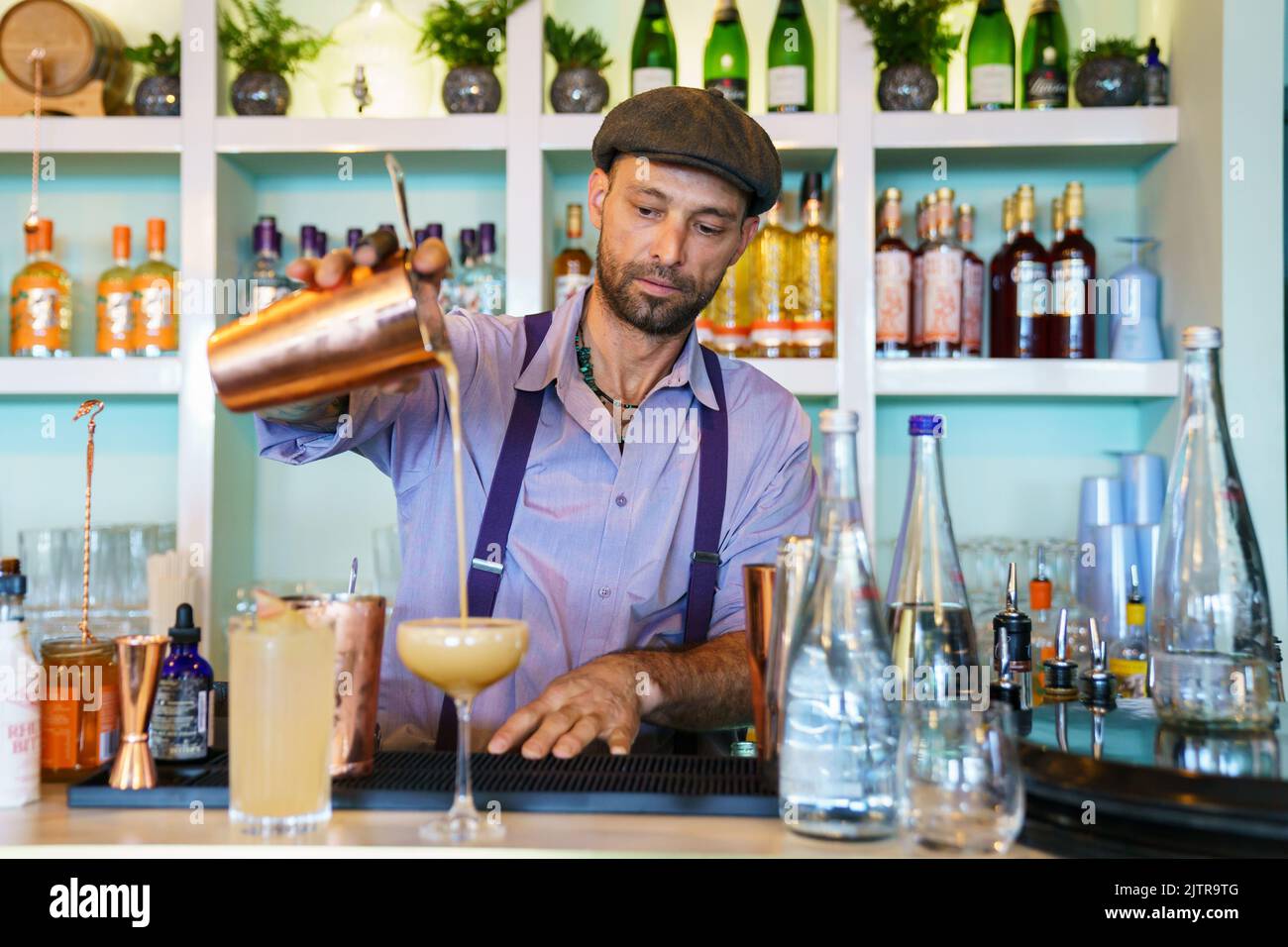 Barman prepares a cocktail at The Rosewater Pavilion at Wimbledon Park ...