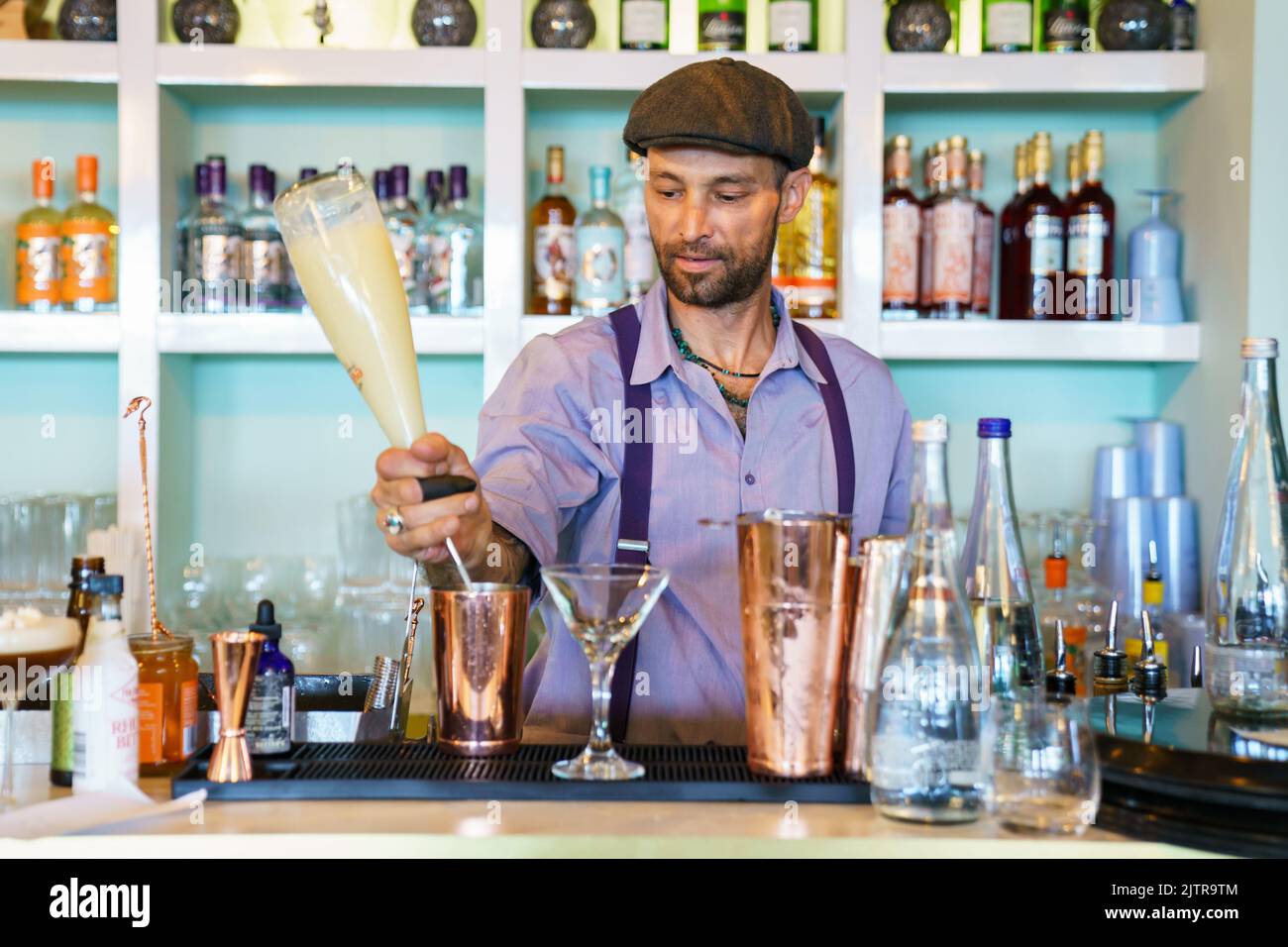 Barman prepares a cocktail at The Rosewater Pavilion at Wimbledon Park ...