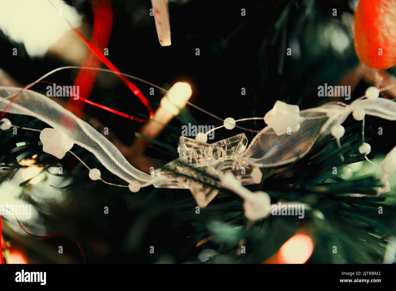 Tone cozy Christmas image with white ribbon and garland and star shape ...