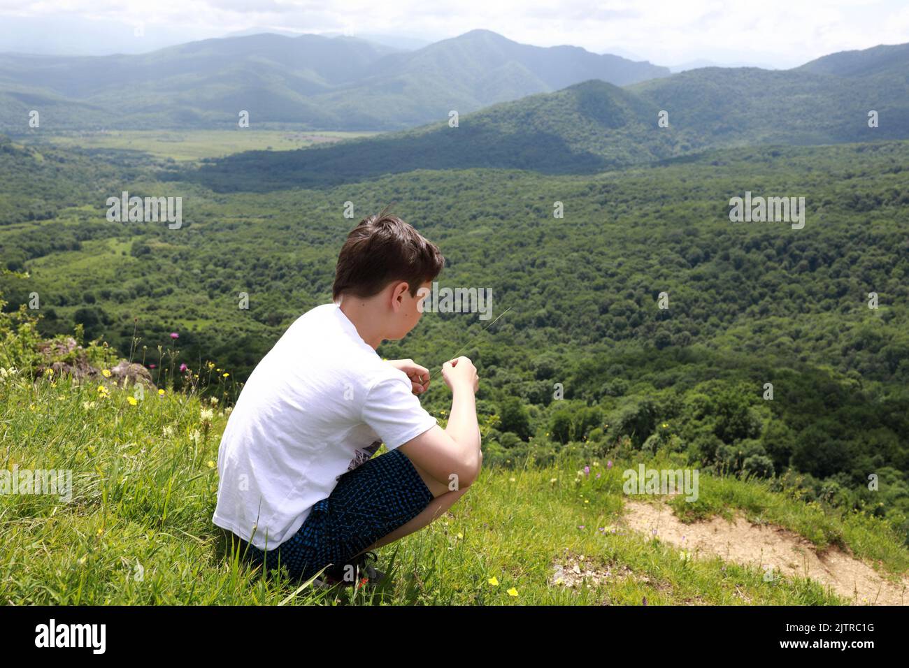 Portrait of boy on Azish-Tau ridge background, Adygea Stock Photo - Alamy