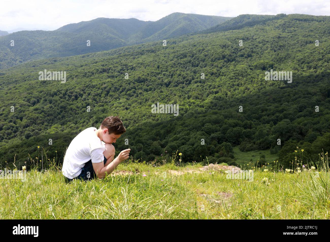 Portrait of child on Azish-Tau ridge background, Adygea Stock Photo - Alamy