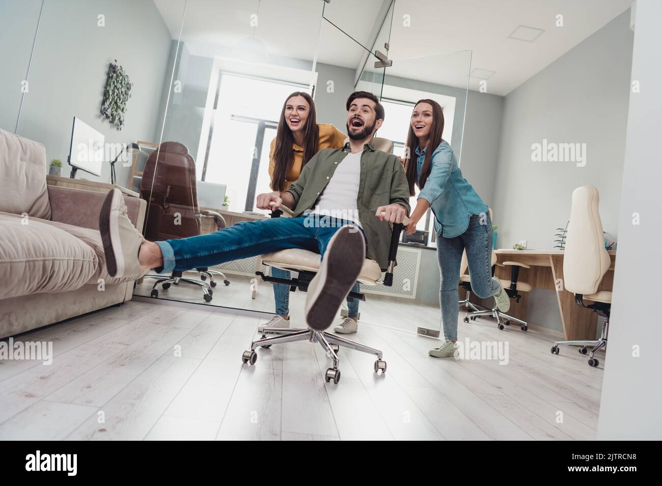 Full size photo of three overjoyed satisfied people playing enjoy pause ...