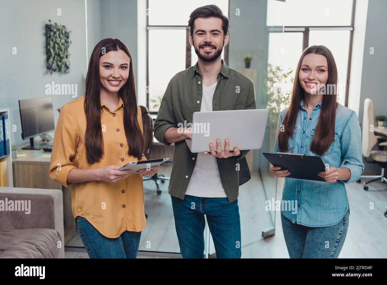 Photo of three successful smart employee use gadgets organization ...