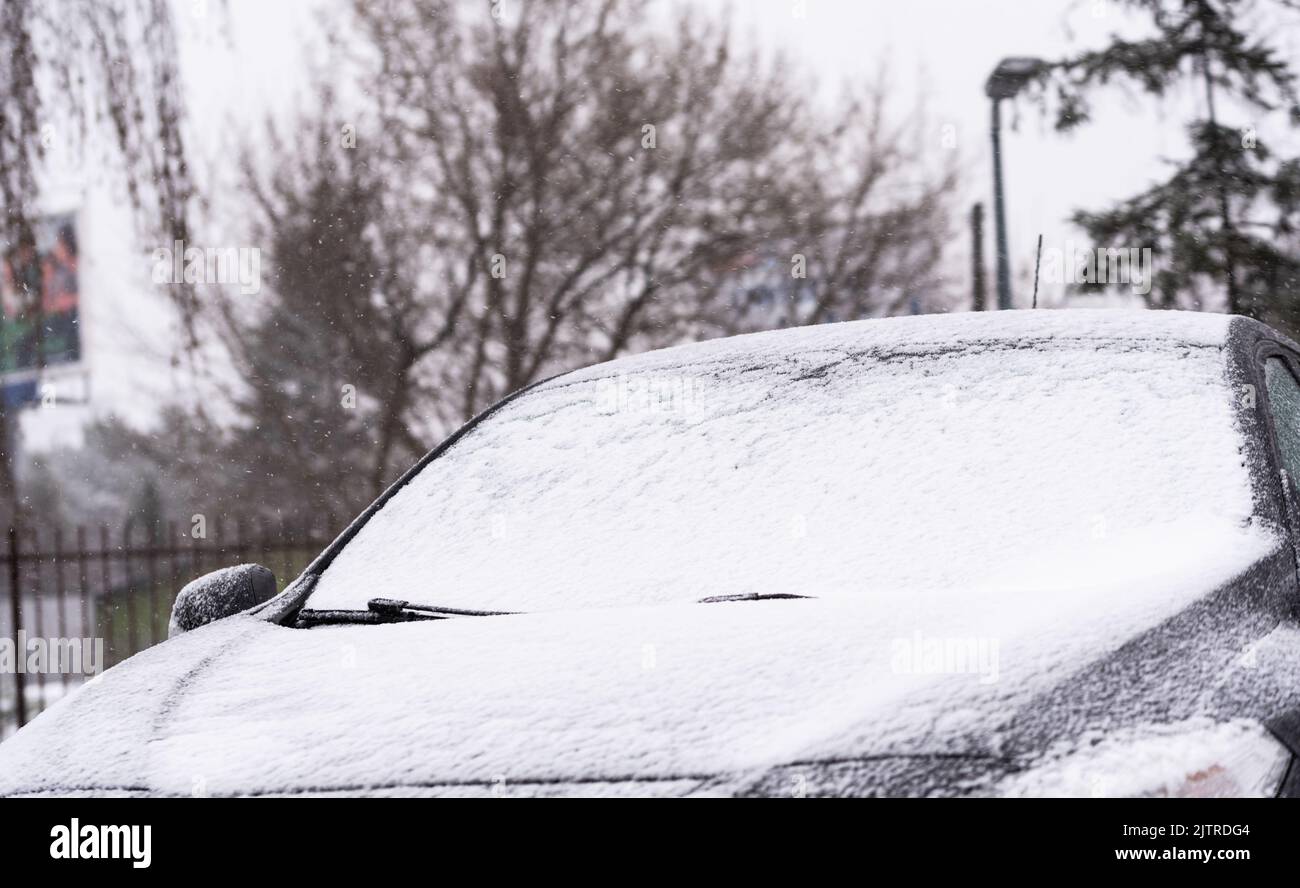 Snow on the windshield of the car. Winter weather for drivers. Snowfall ...
