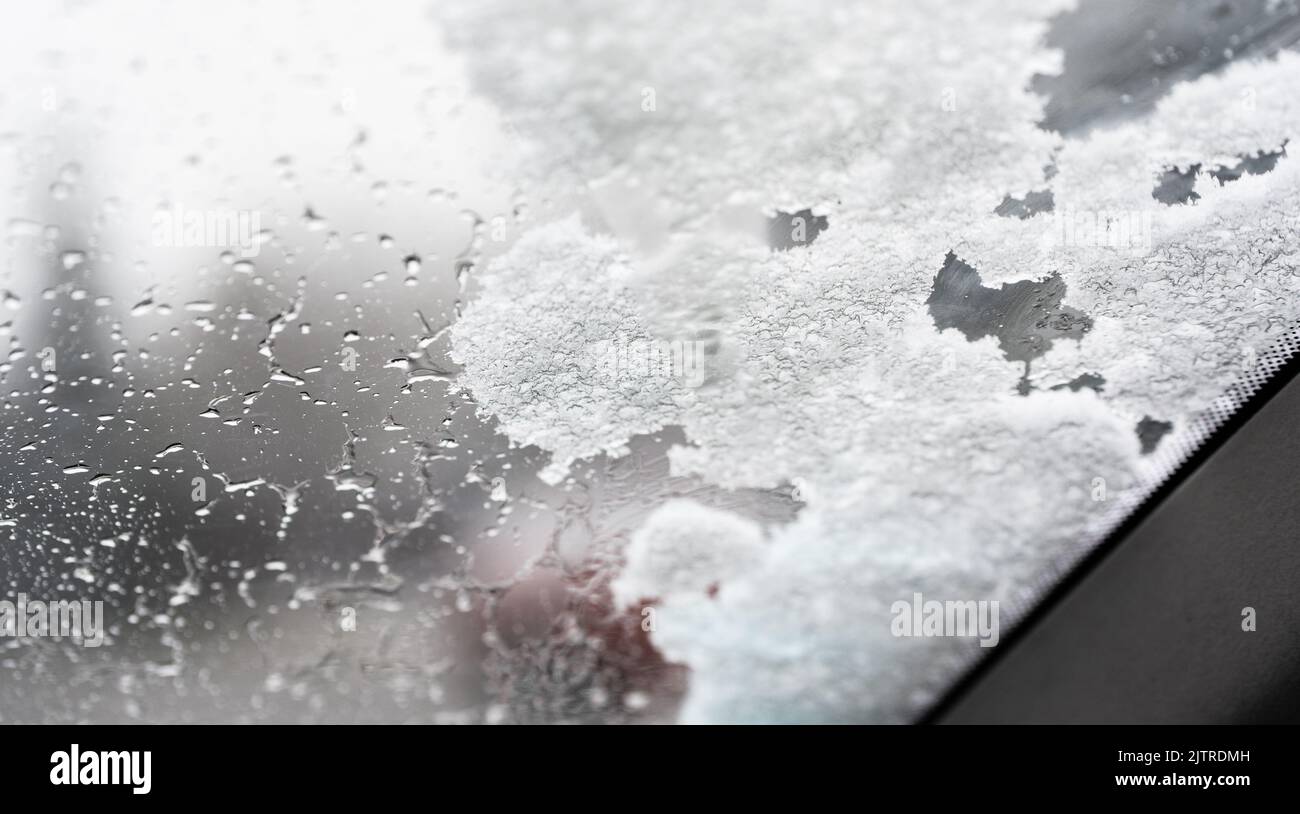 Snow on the windshield of the car. Winter weather for drivers. Snowfall ...