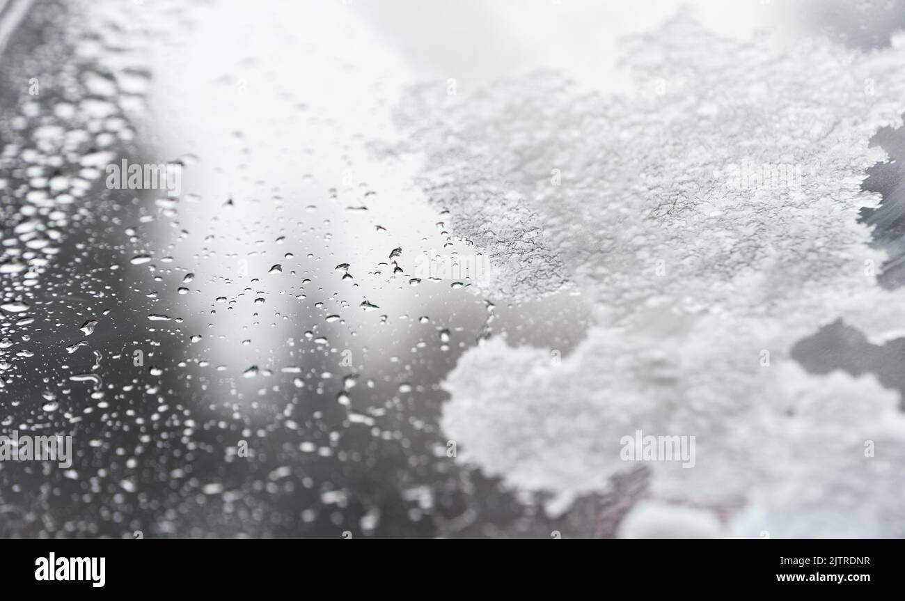 Snow on the windshield of the car. Winter weather for drivers. Snowfall ...