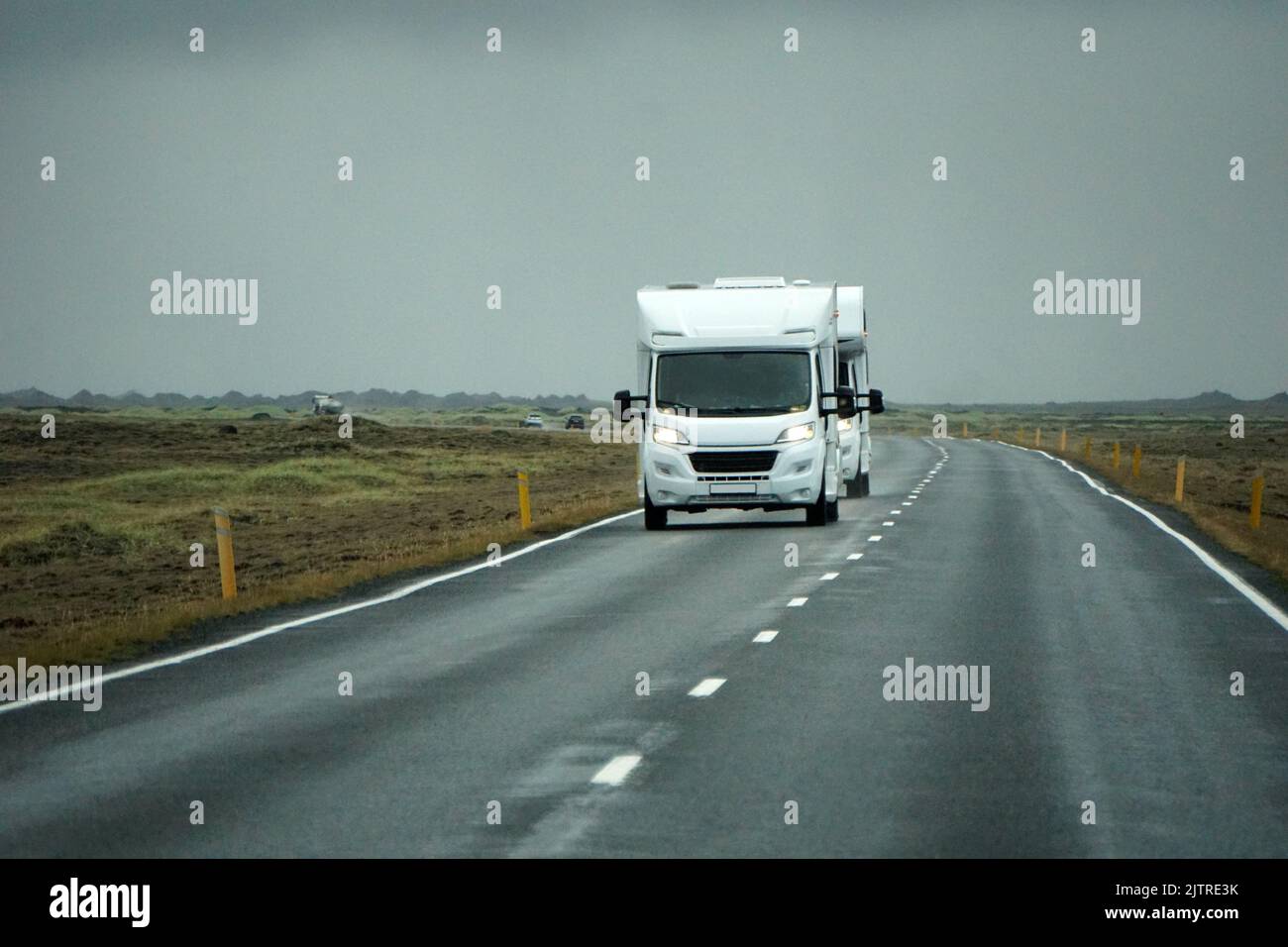 Iceland, Sudurland - August 8th, 2022 - White camper, RV driving on a ...