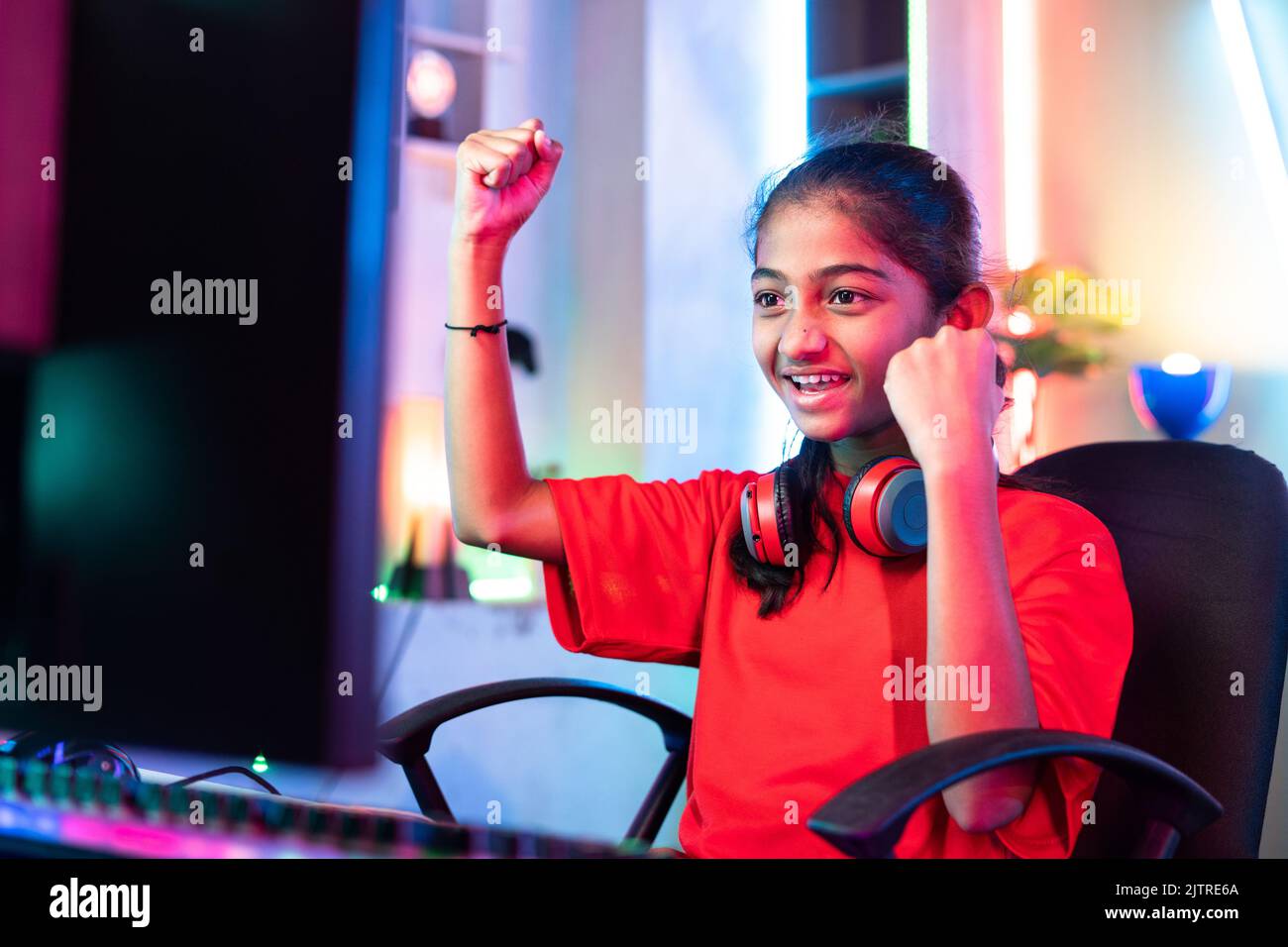 excited girl kid celebrating win or victory while playing online video ...