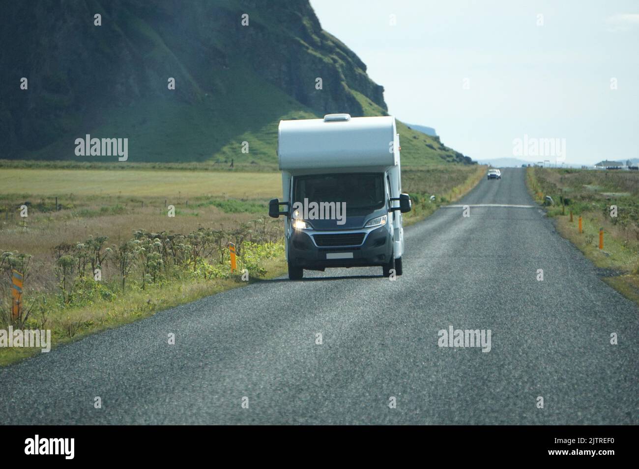Iceland, Sudurland - August 8th, 2022 - White camper, RV driving on a ...